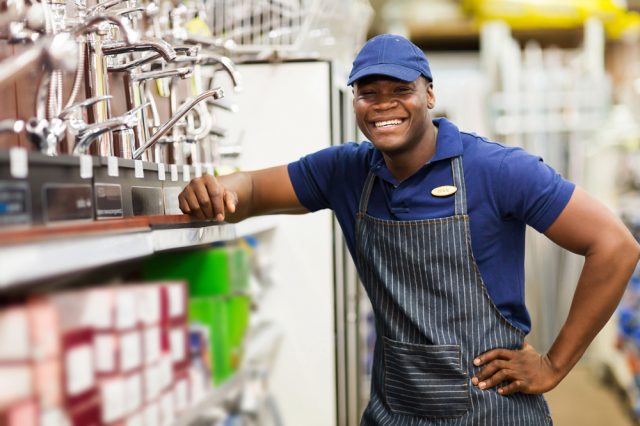 cheerful african hardware store worker - Littlegate Publishing