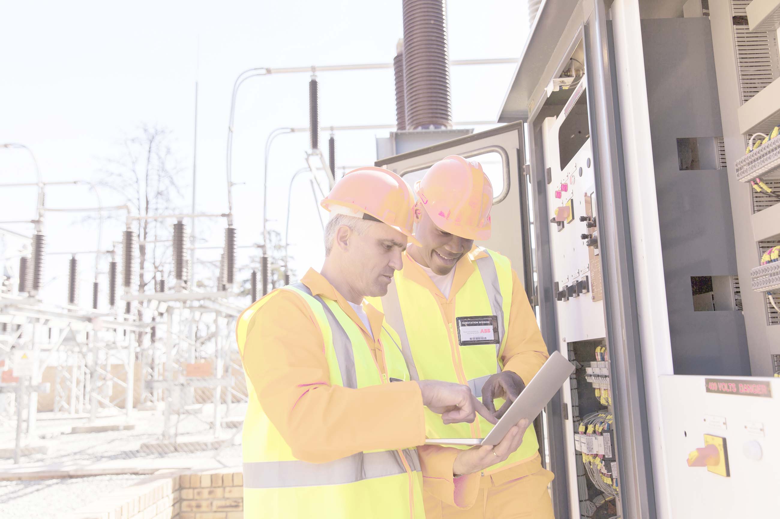 two electrical engineers using laptop computer - Littlegate Publishing
